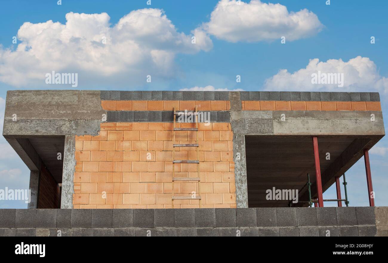 Low angle of a newly constructed building under a cloudy sky Stock ...