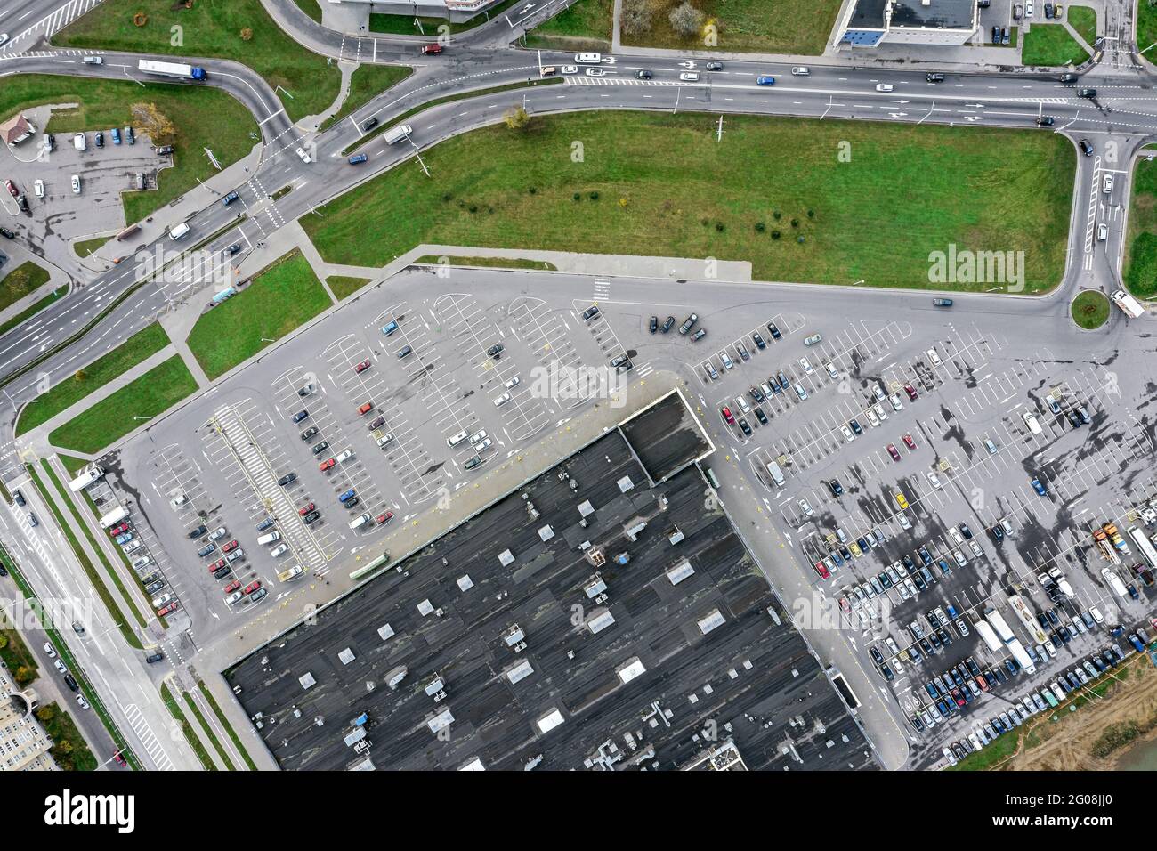 aerial top view from above of big shopping mall and parking lot with ...