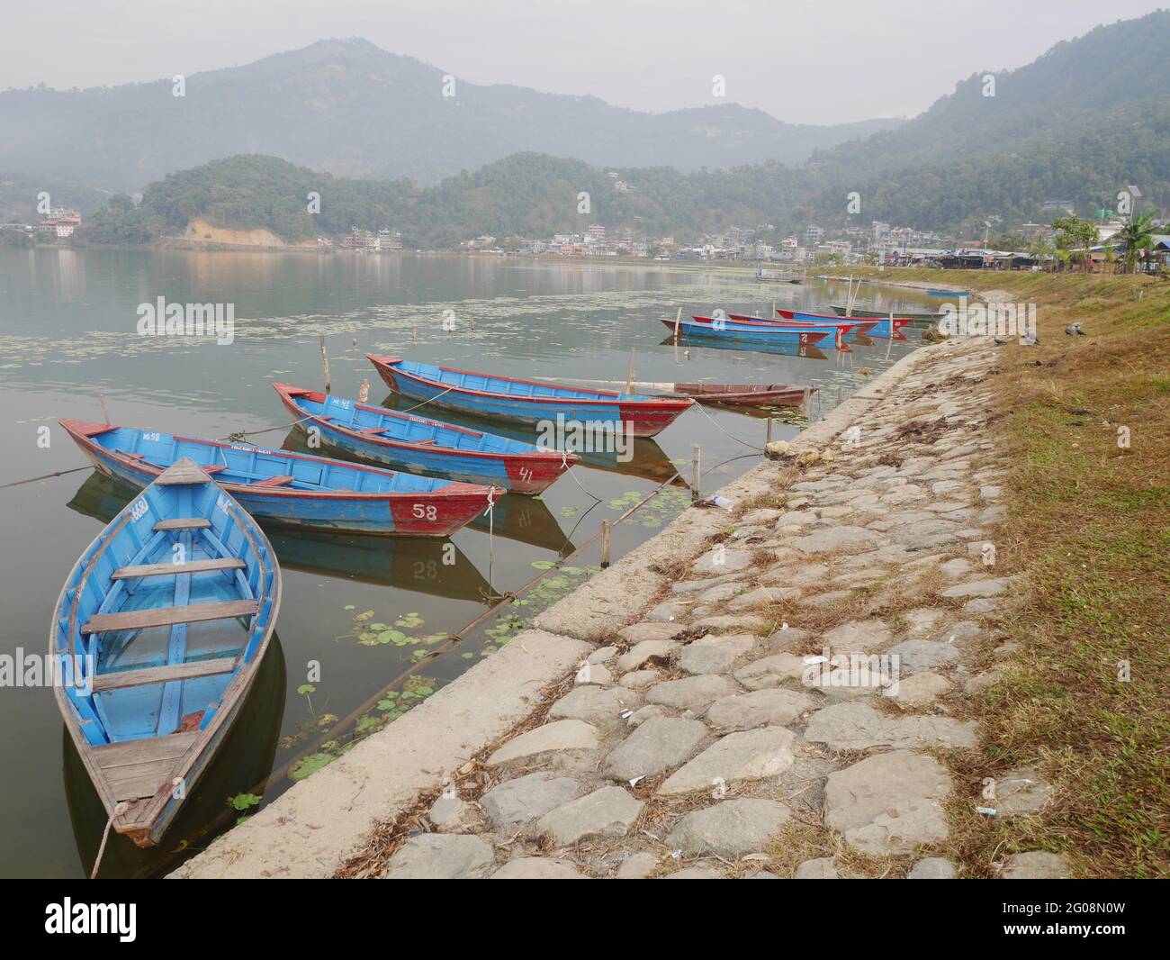 Wooden canoe boat of nepali people floating in Phewa Tal or Fewa ...