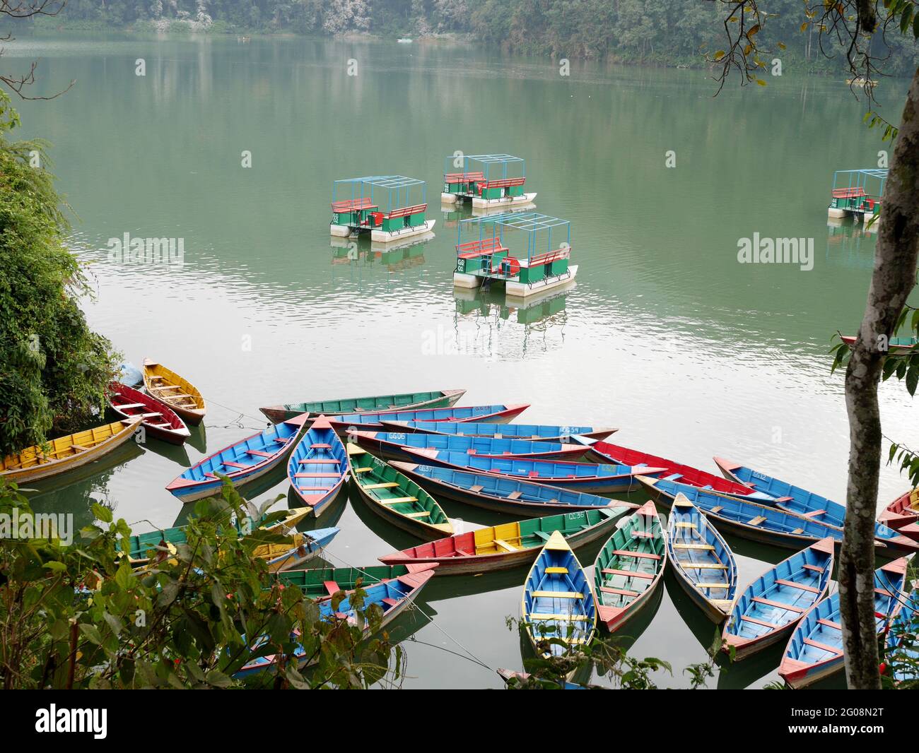 Wooden canoe boat of nepali people floating in Phewa Tal or Fewa ...