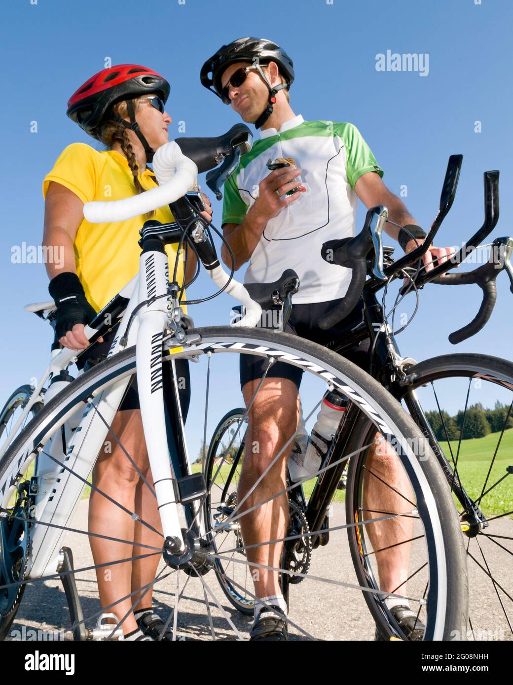 Cyclists with race bike during break in nature Stock Photo - Alamy