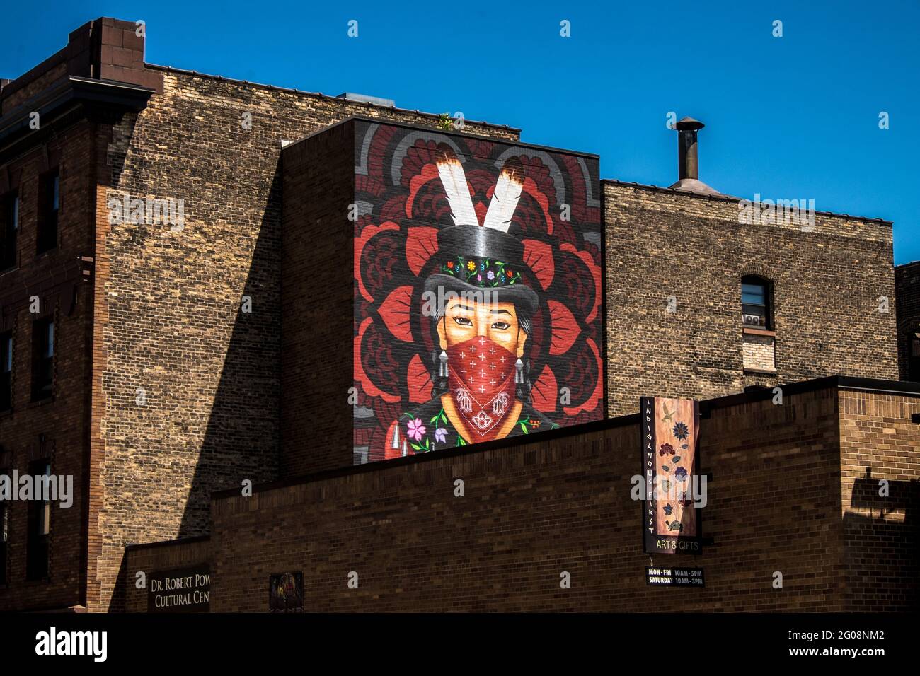 A large mural on a wall in Duluth, Minnesota, shows a Native American ...
