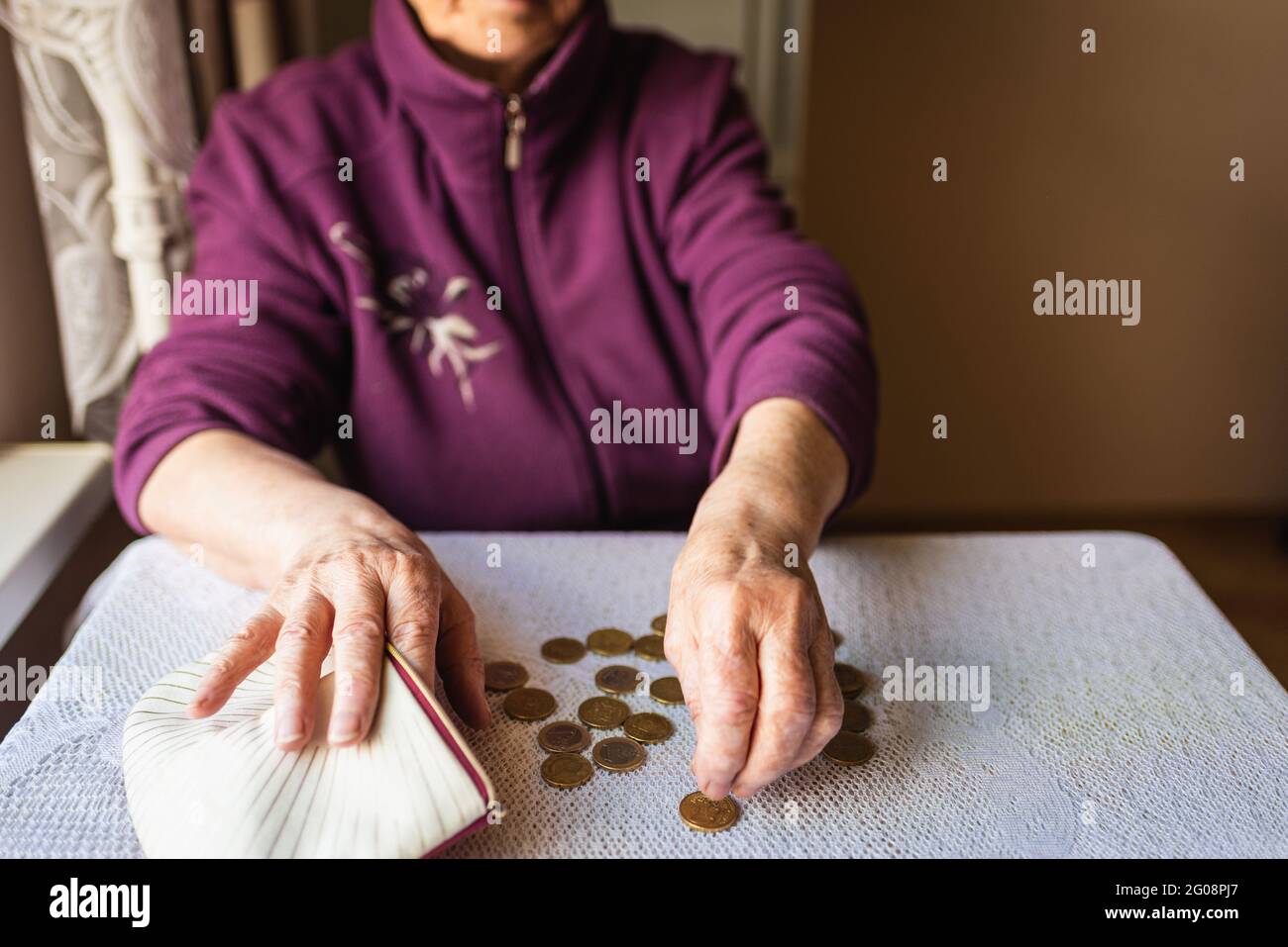 Old person counting coins hi-res stock photography and images - Alamy