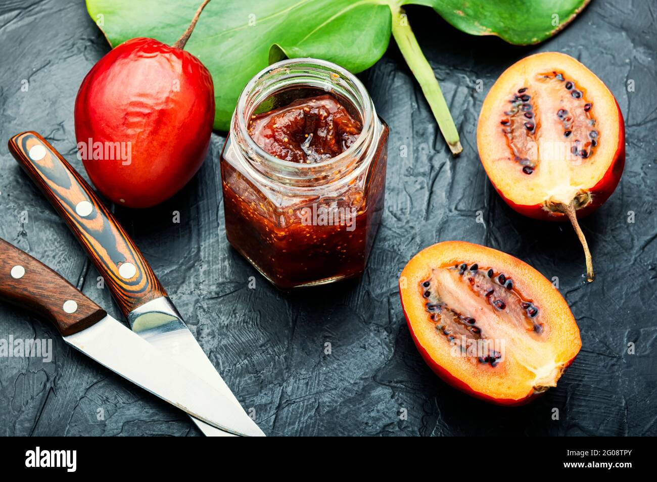 Delicious exotic tamarillo jam in a glass jar Stock Photo - Alamy
