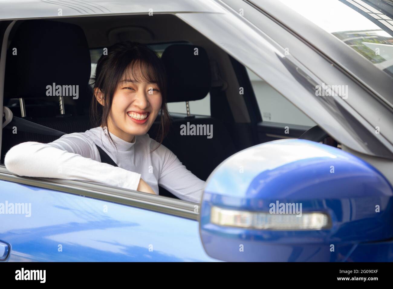 Attractive asian girl sitting in a car hi-res stock photography and ...