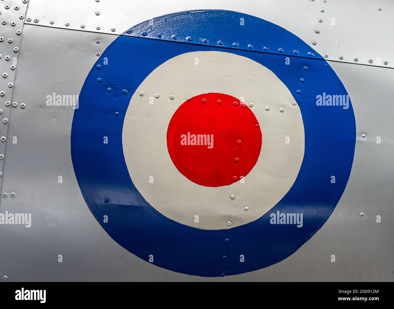 Large retro RAF target symbol on abandoned old aeroplane. Silver metal ...