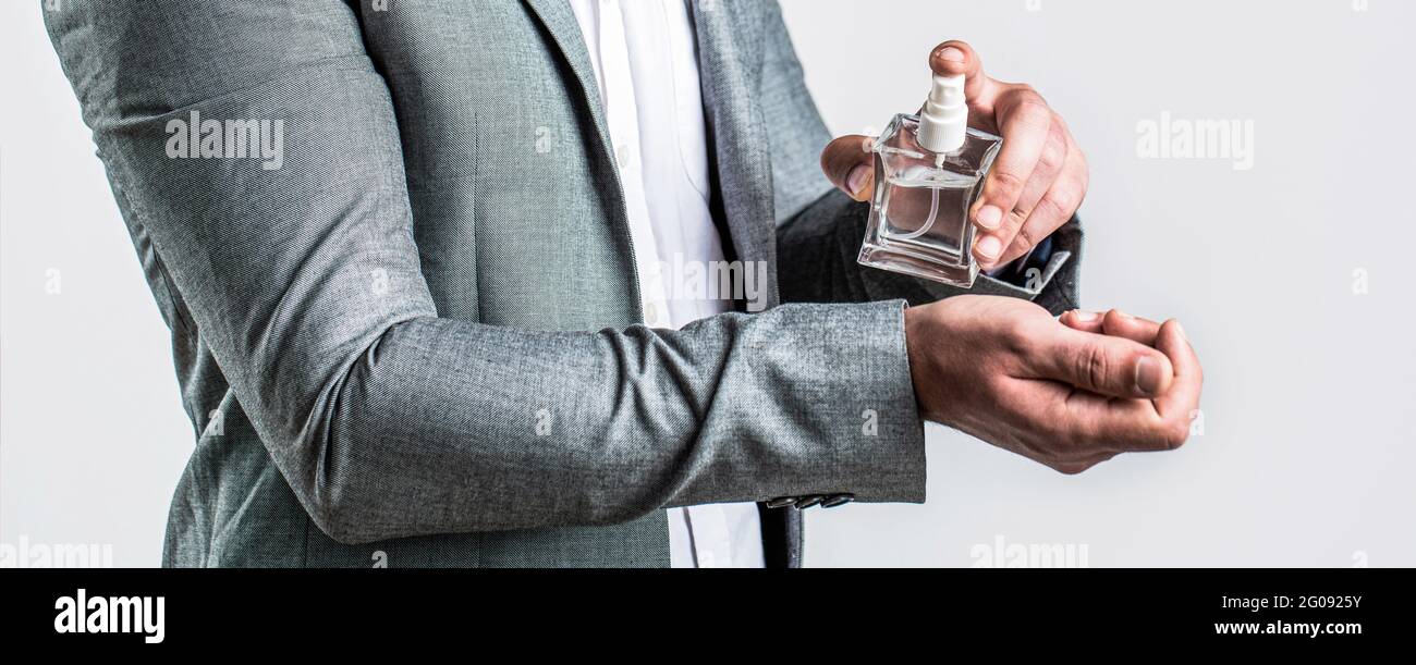 Fragrance smell. Men perfumes. Fashion cologne bottle. Man holding up ...