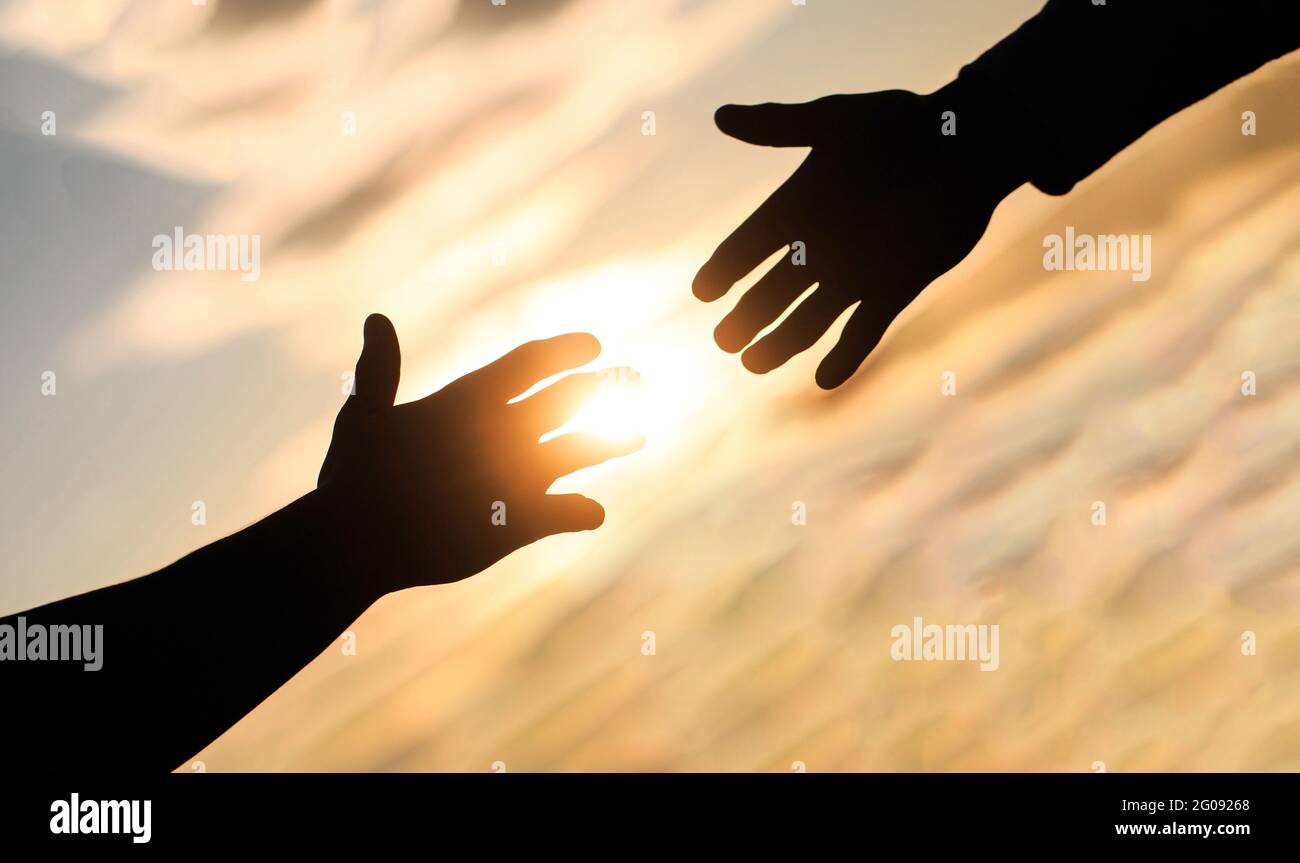 Giving a helping hand. Rescue, helping gesture or hands. Mercy, two ...
