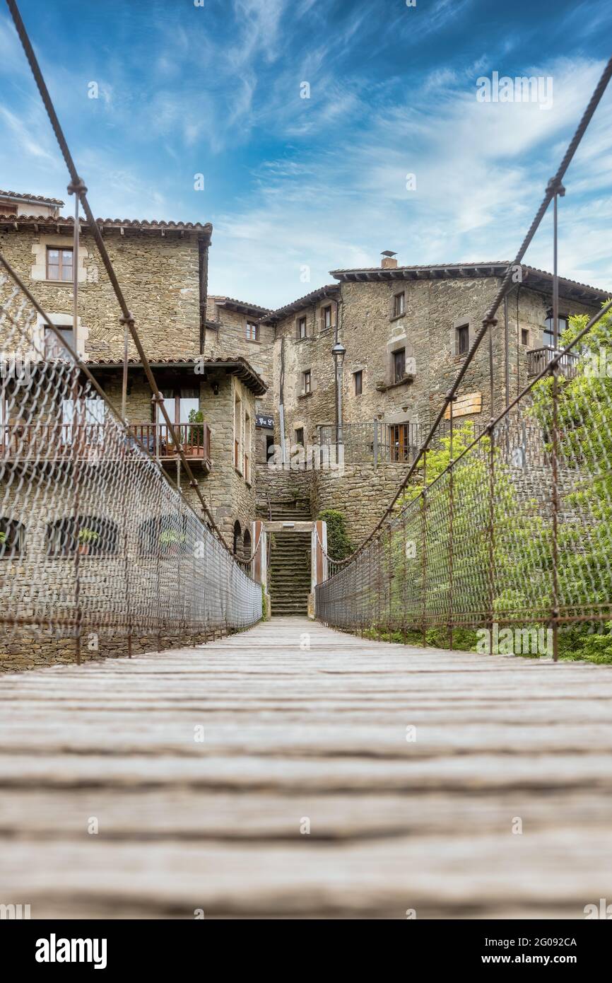 Bottom view picture from a suspension bridge in small, ancient spanish ...