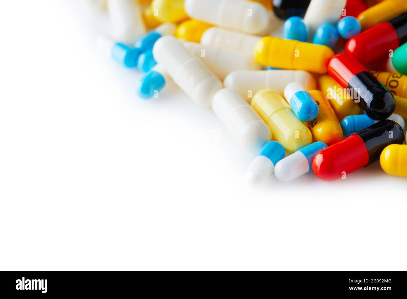 capsules of different colors and sizes against white background Stock ...