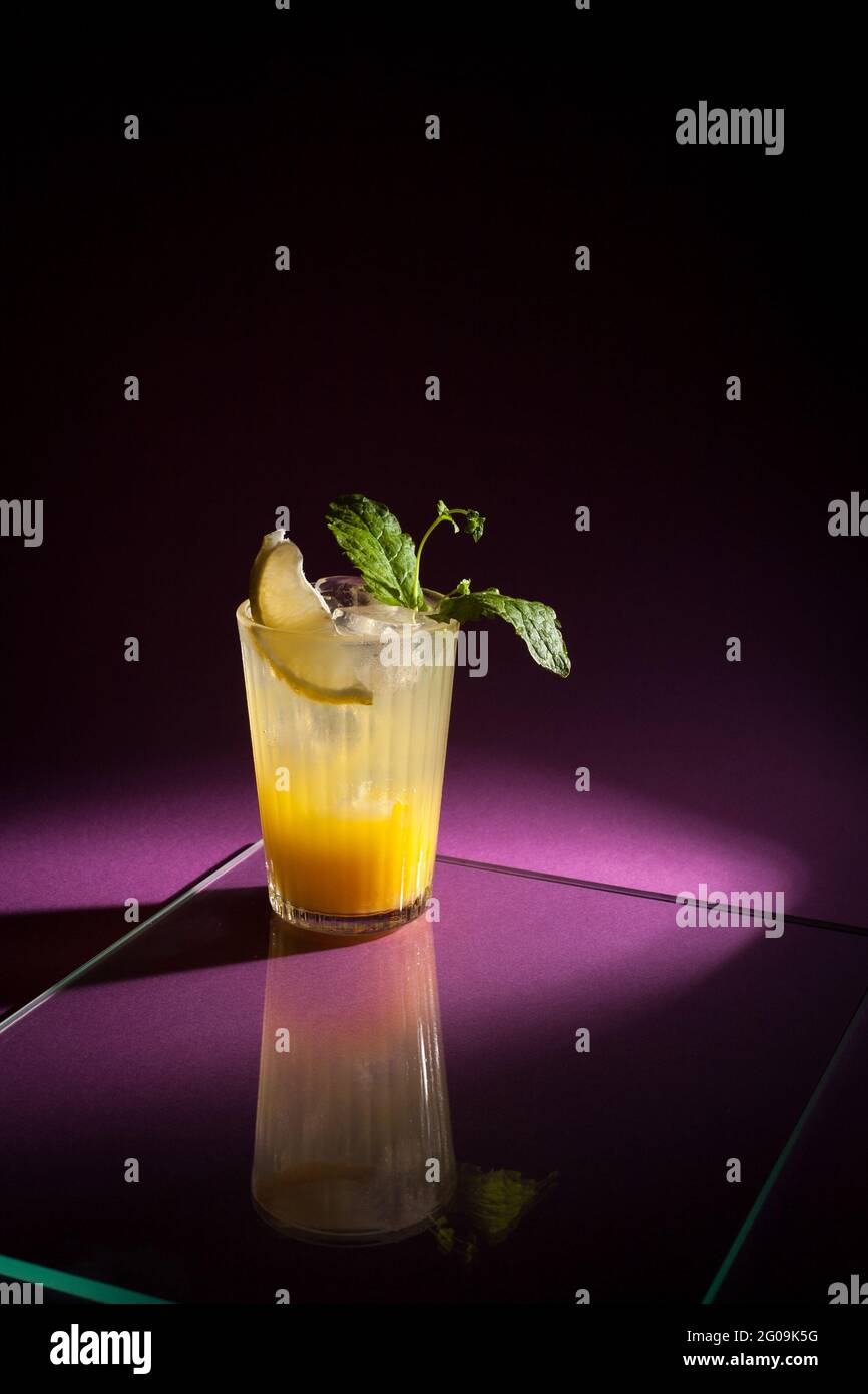 Orange Cocktail With Garnishes Stock Photo - Alamy