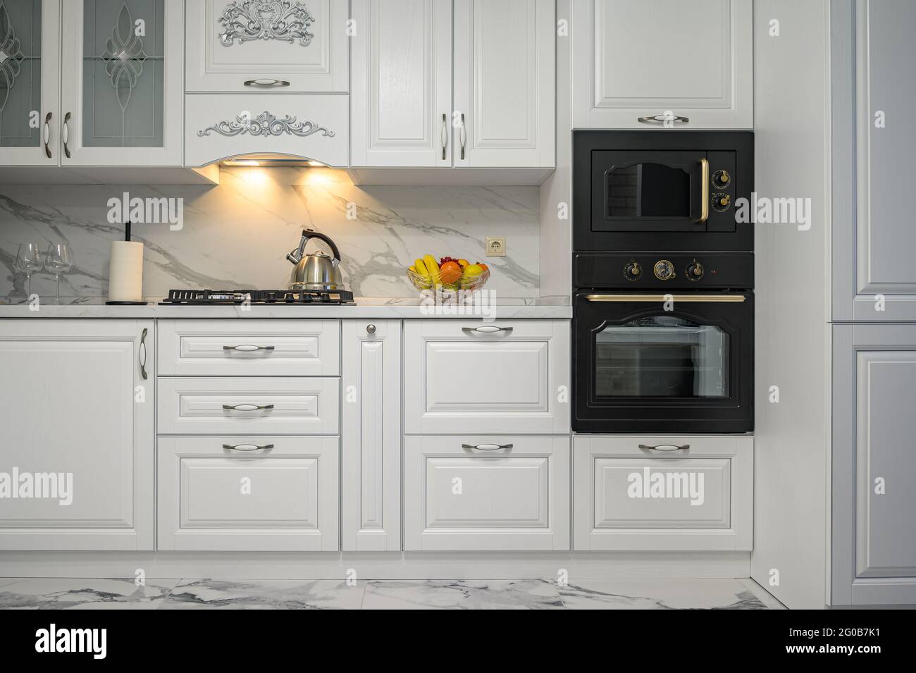 White kitchen in classic style, front view Stock Photo - Alamy