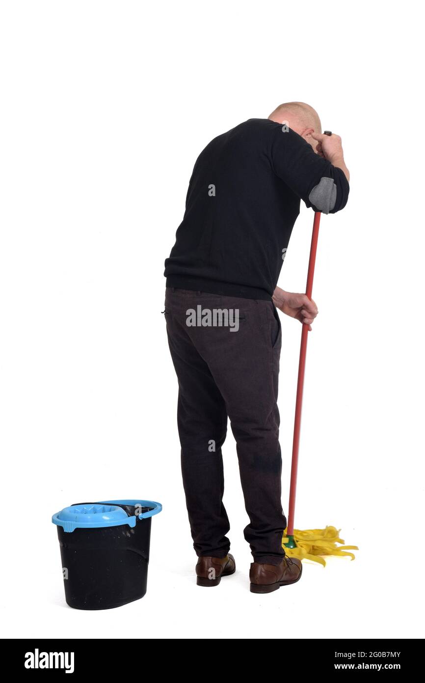 rear view of a man who is mopping the floor with a mop Stock Photo - Alamy