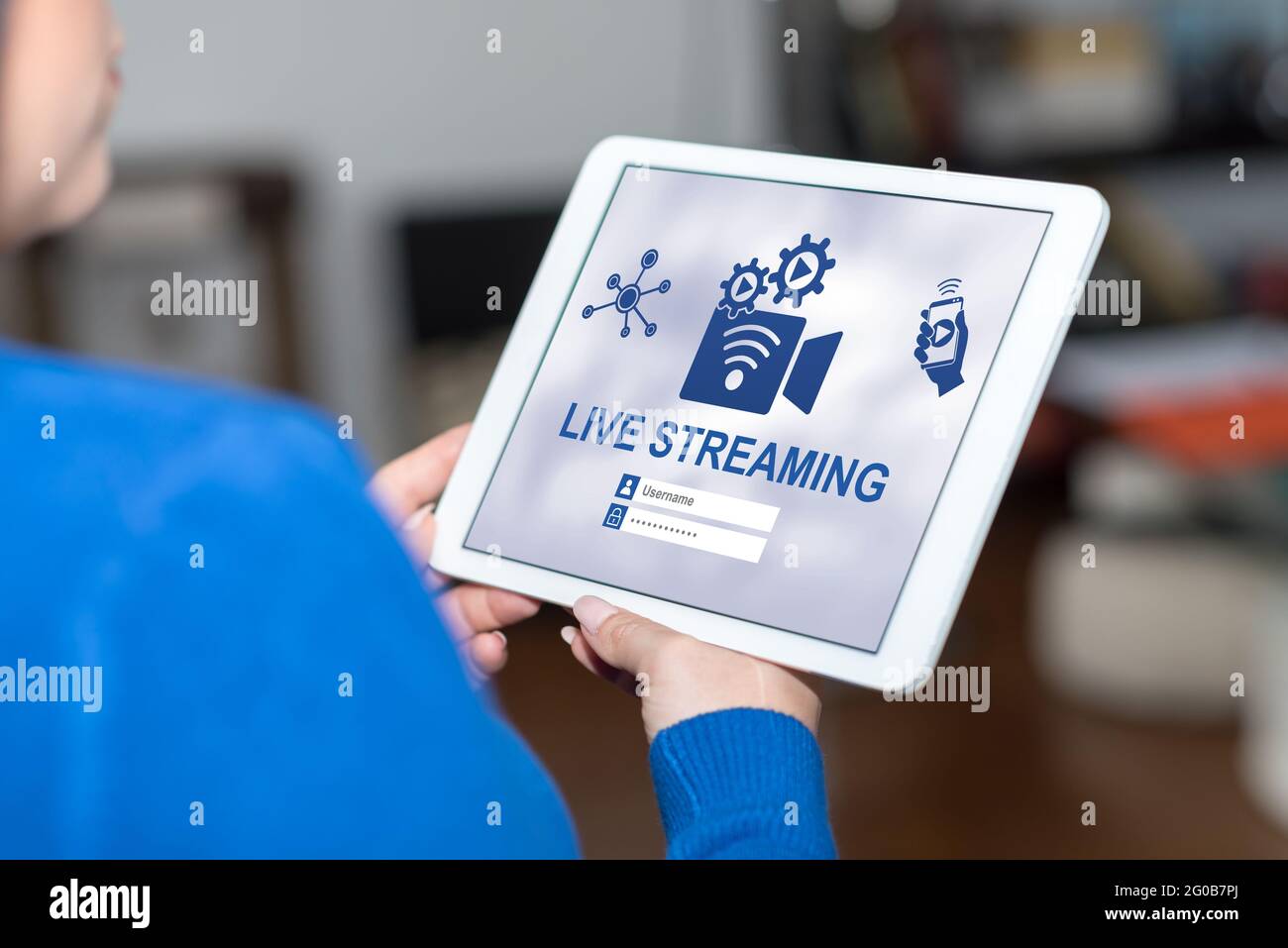 Tablet screen displaying a live streaming concept Stock Photo - Alamy