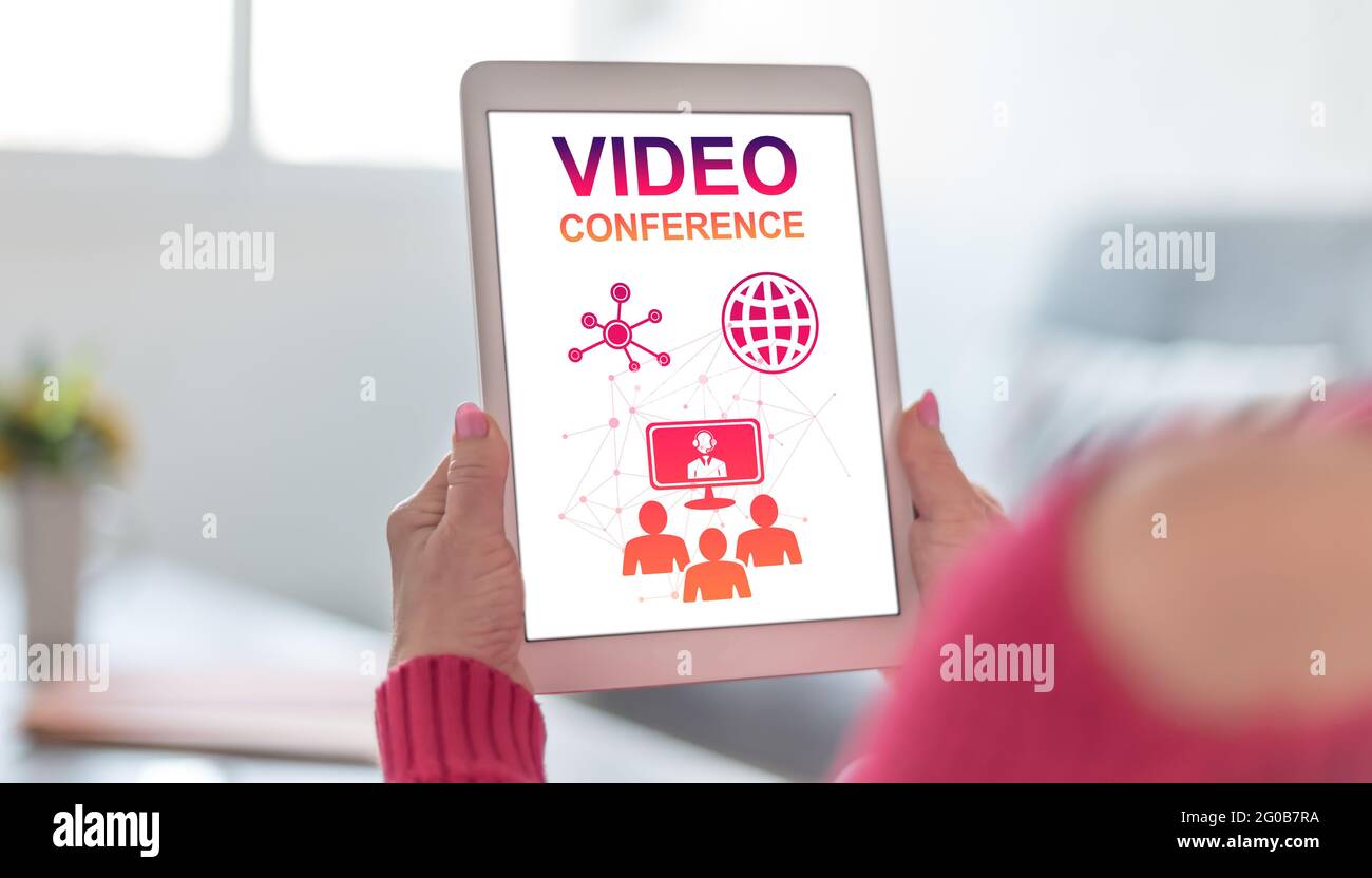 Tablet screen displaying a video conference concept Stock Photo - Alamy