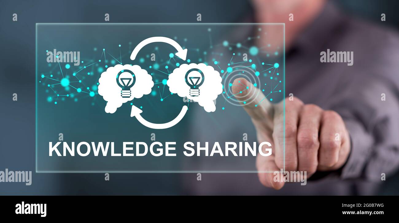 Man touching a knowledge sharing concept on a touch screen with his ...