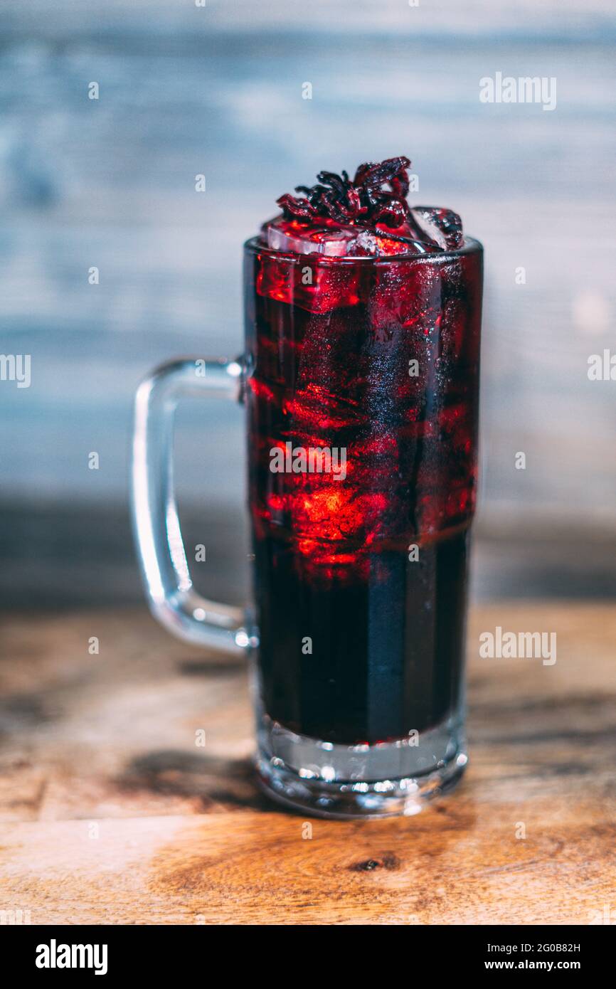 A glass of dark juice cocktail drink Stock Photo - Alamy