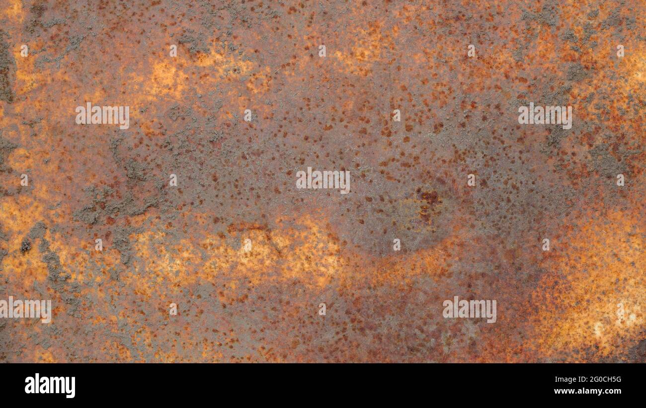 The texture of a rusty metal surface covered with dirt and multicolored ...