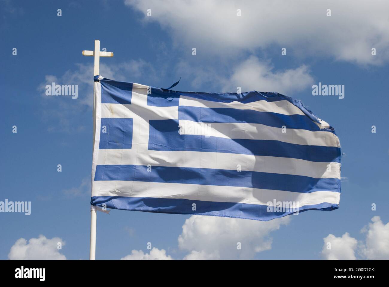 Greek flag on a pole waving in the wind Stock Photo - Alamy