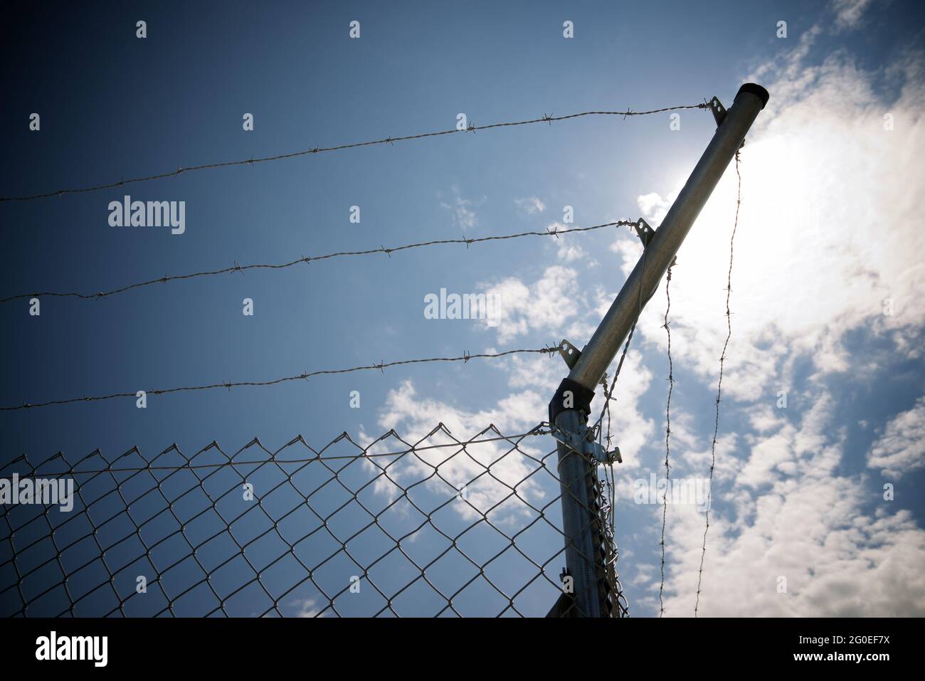 Barbed wire fence view in Spain Stock Photo - Alamy