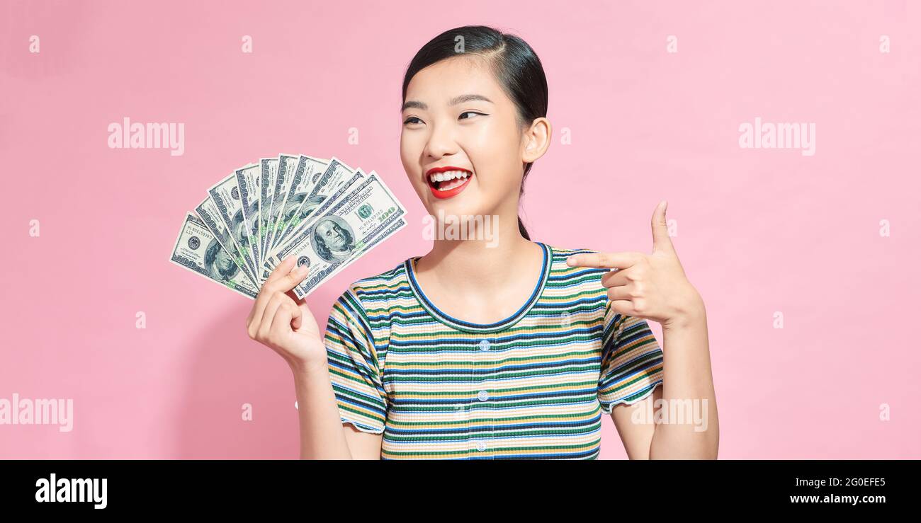 Excited young woman girl posing isolated on pink background studio ...