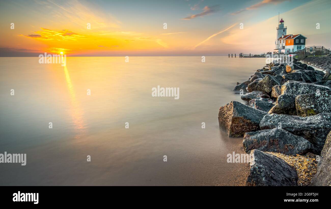Horse of Marken lighthouse during sunrise. Marken is a small fishing ...