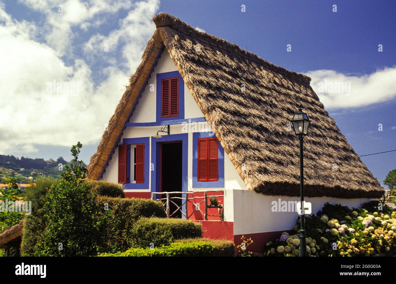A colourful typical Casa de Colmo, a traditional house with a thatched ...
