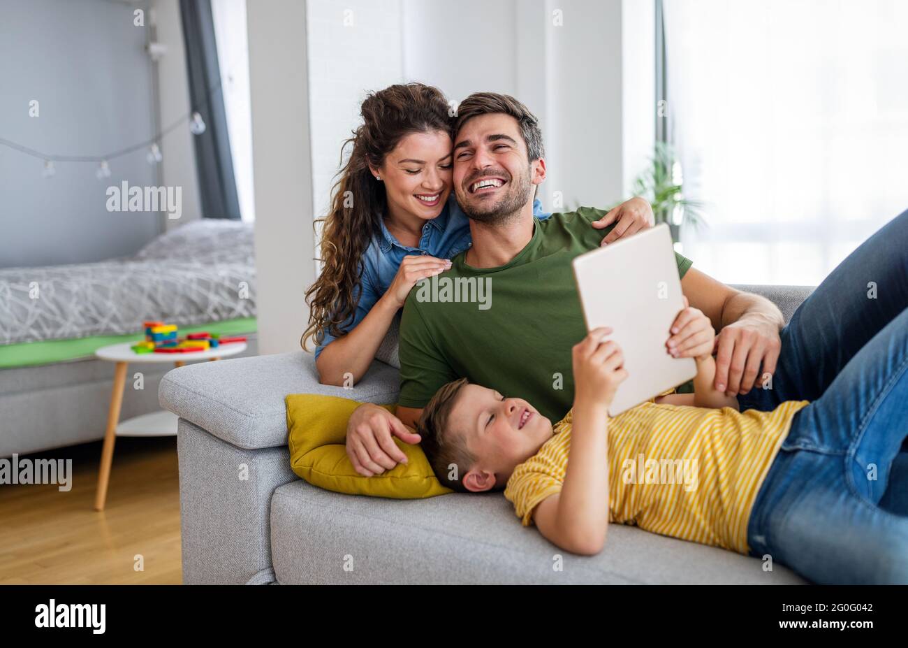 Young happy family having fun, playing together at home Stock Photo - Alamy
