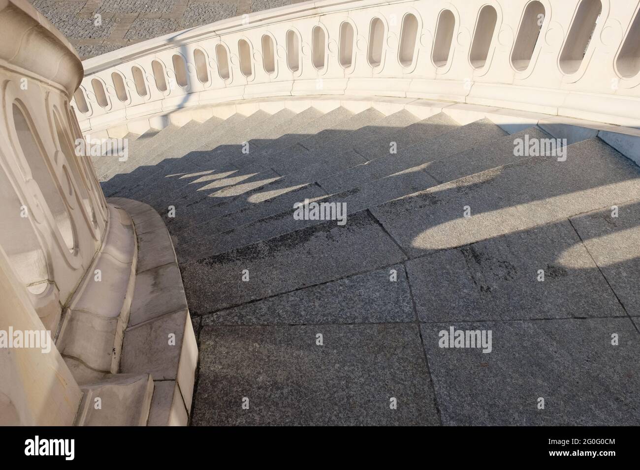 Ancient stone twisted staircase leading down. Large staircase with ...