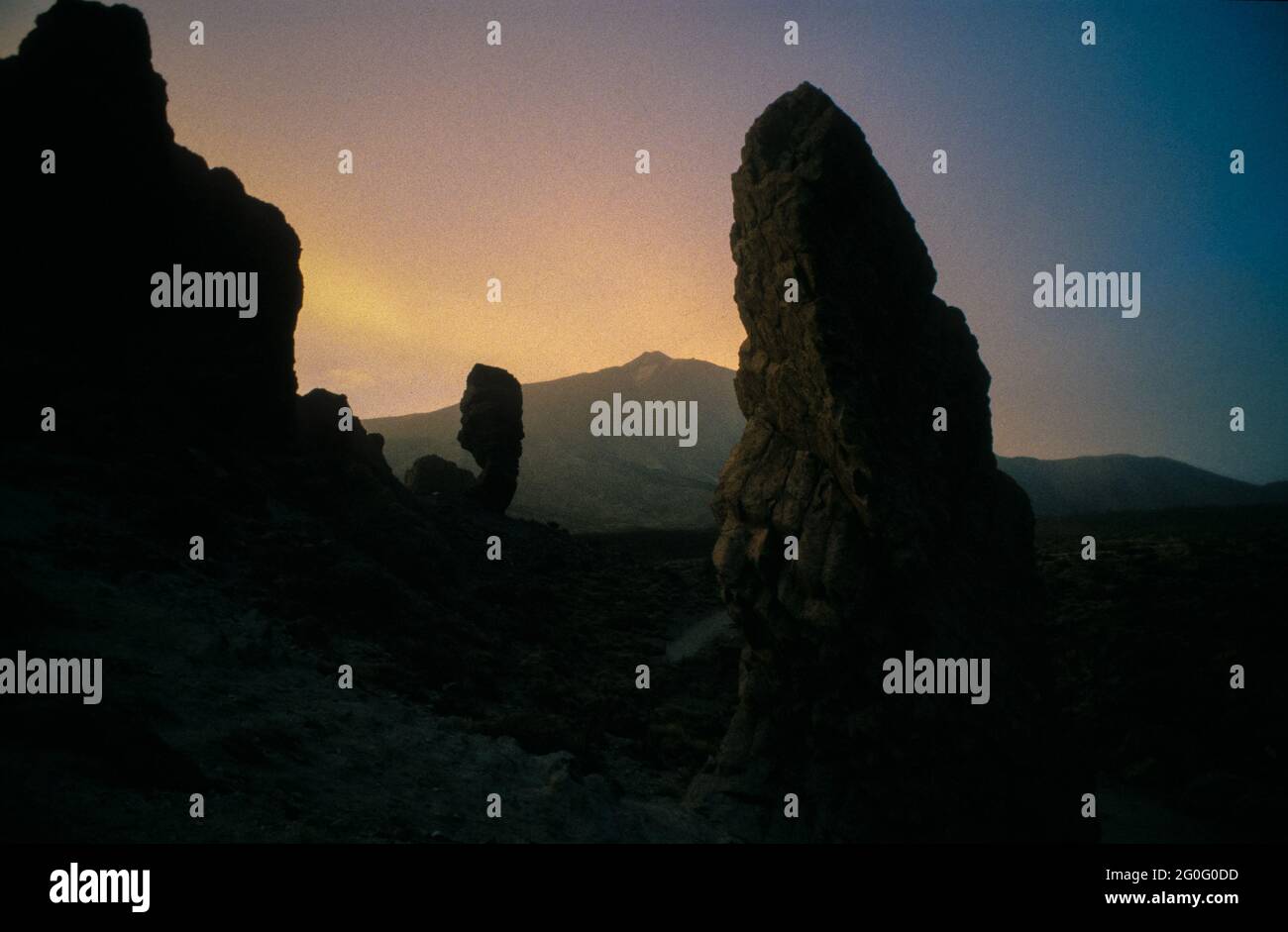 Mount Teide at sunset as seen from the bizarre rocks of Roques de ...