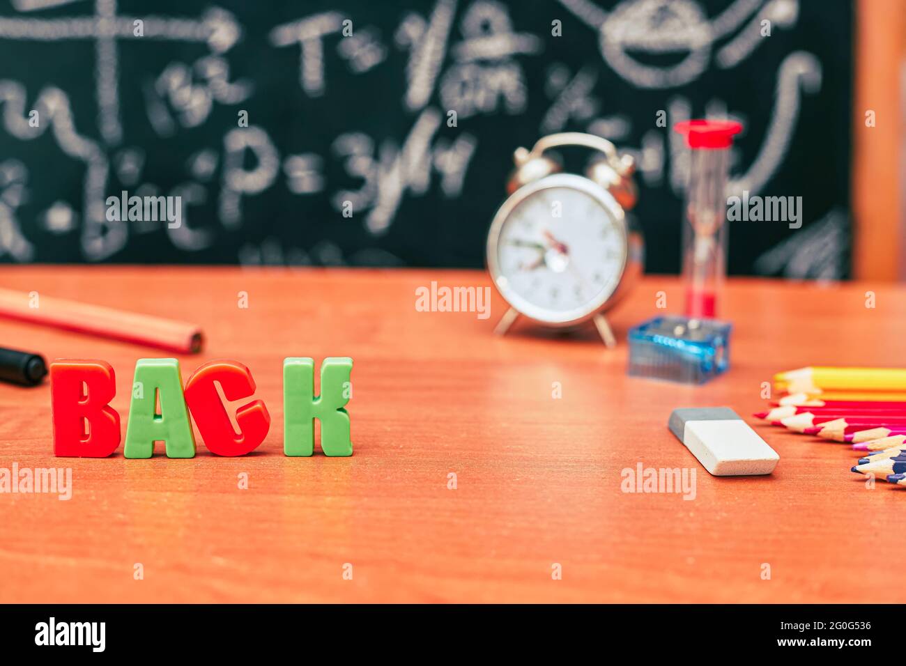 school still life, plastic lettering "back" in the background school ...