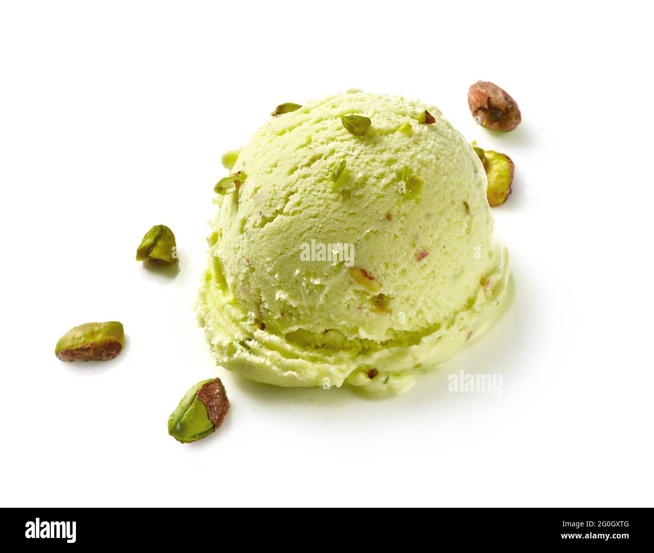 Scoop of pistachio ice cream with pistachio nuts on white background ...