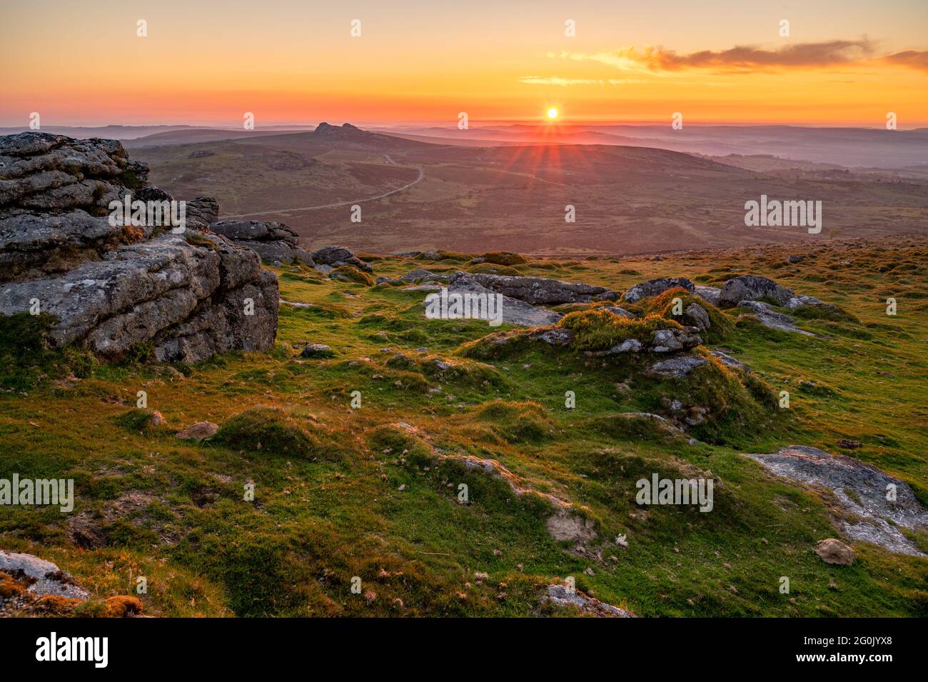 Morning light as the sun shines on Rippon Tor, Dartmoor Stock Photo - Alamy