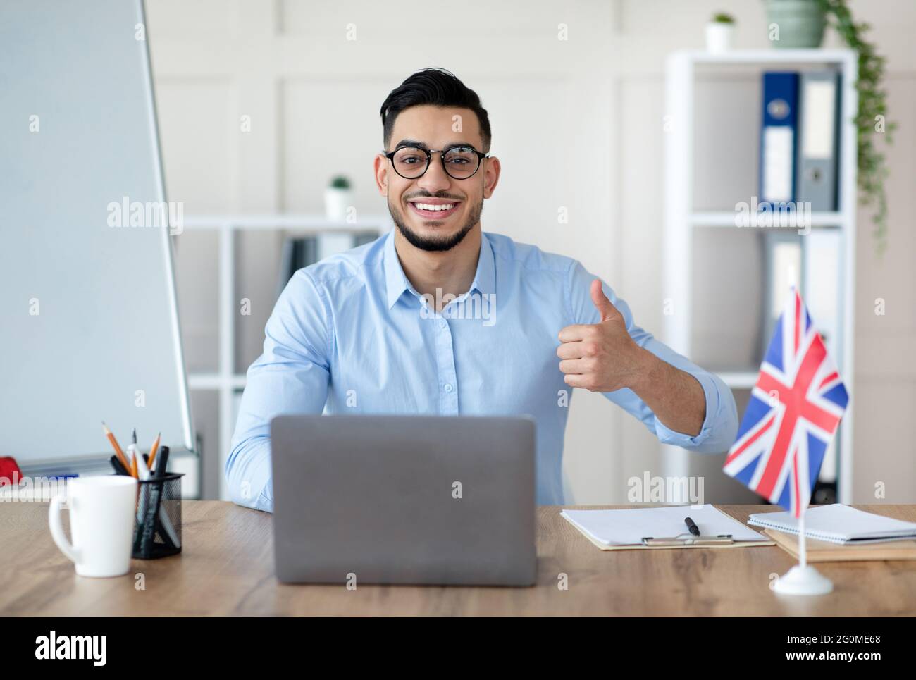 Online tutoring and remote education. Friendly male tutor having video ...