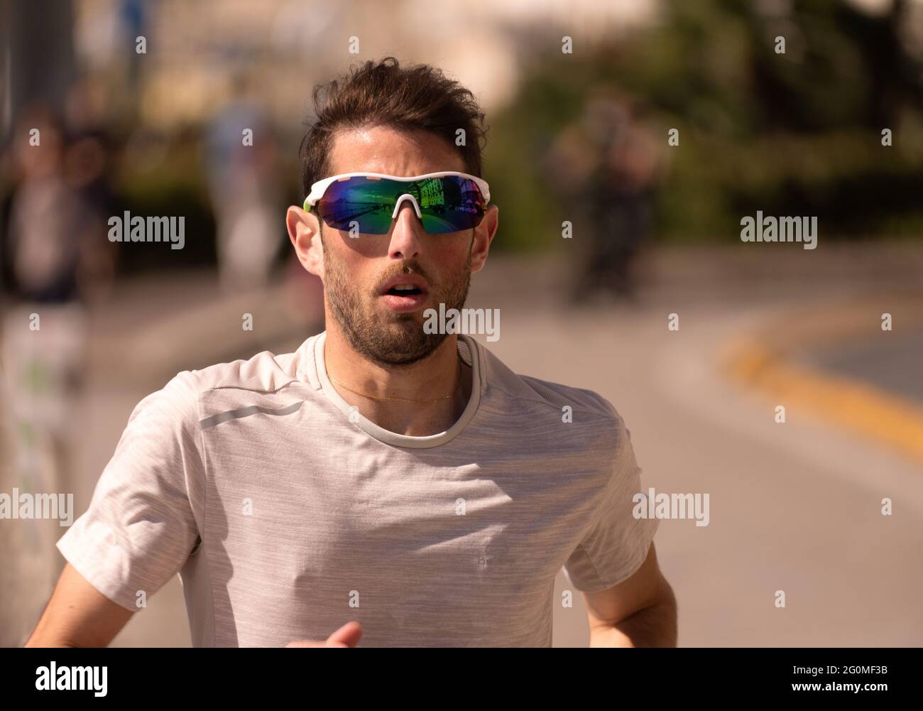 NAPLES, ITALY - May 30, 2021: Bearded man running in the city of Naples ...
