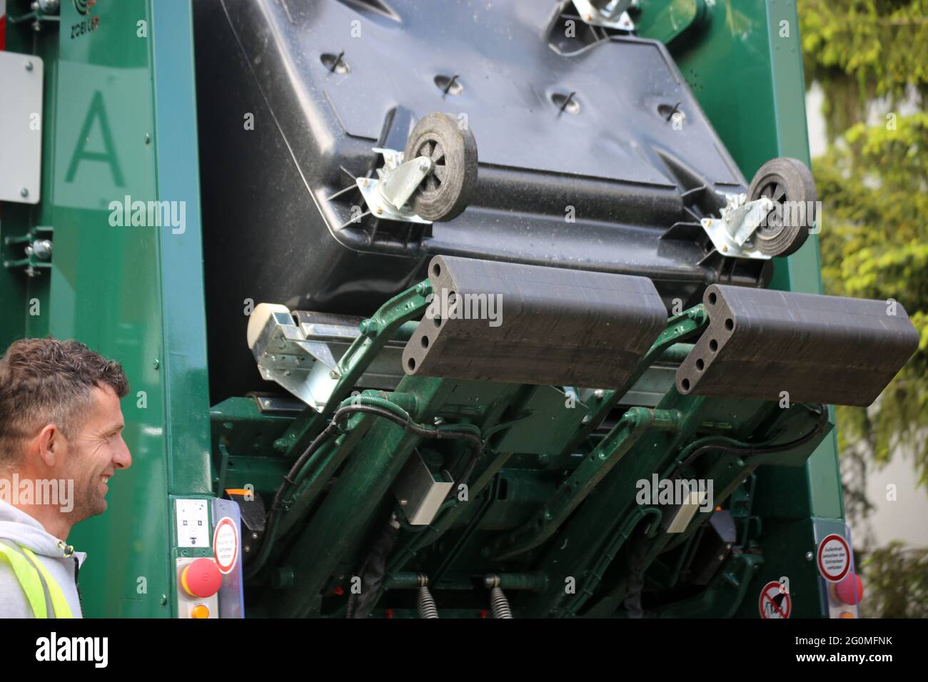 Municipal waste collection in Germany: Waste garbage cans are emptied ...