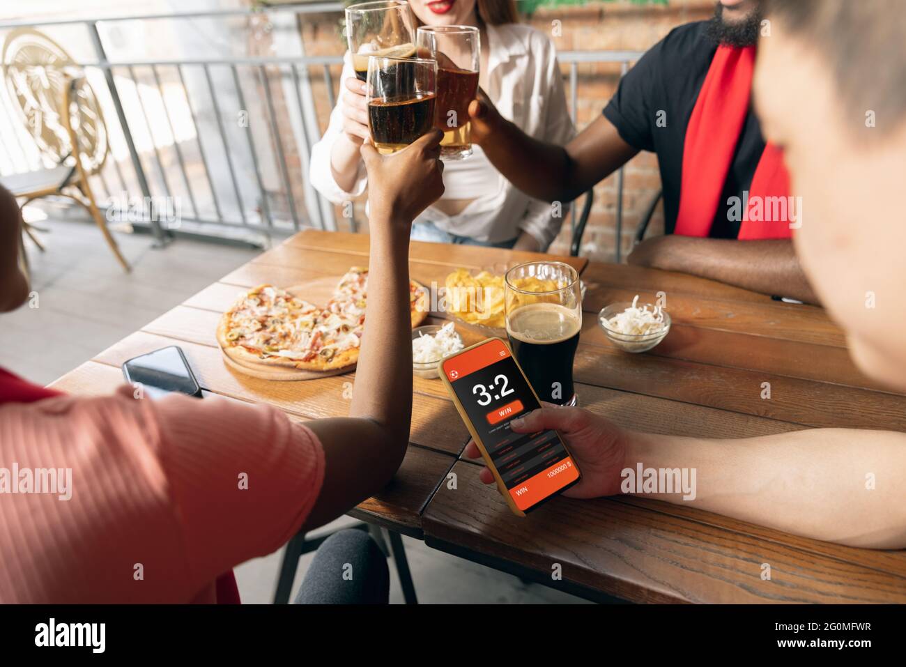 Close-up young men and girls, friends meeting at cafe, pub. Concept of ...