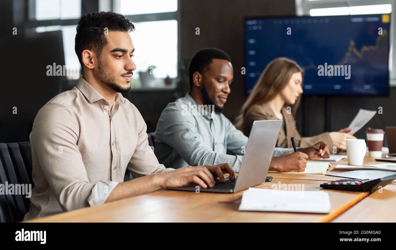 Successful male manager using laptop, typing on keyboard Stock Photo ...