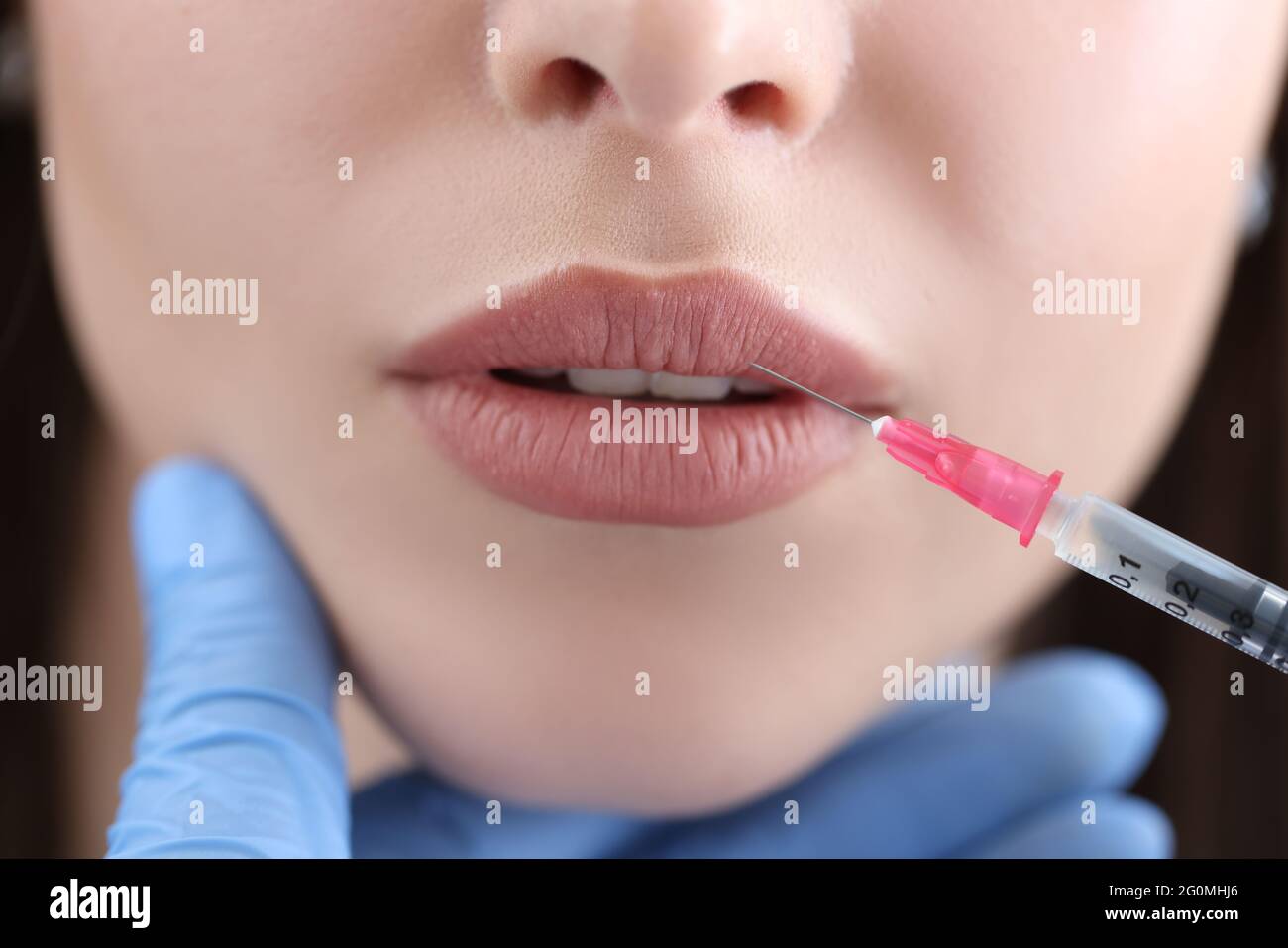 Beautician makes injection beauty lips hi-res stock photography and ...