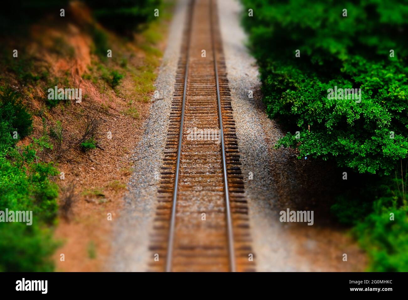 Railroad tracks with tilt shift lens effect Stock Photo - Alamy