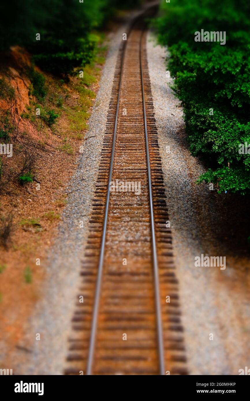 Railroad tracks with tilt shift lens effect Stock Photo - Alamy