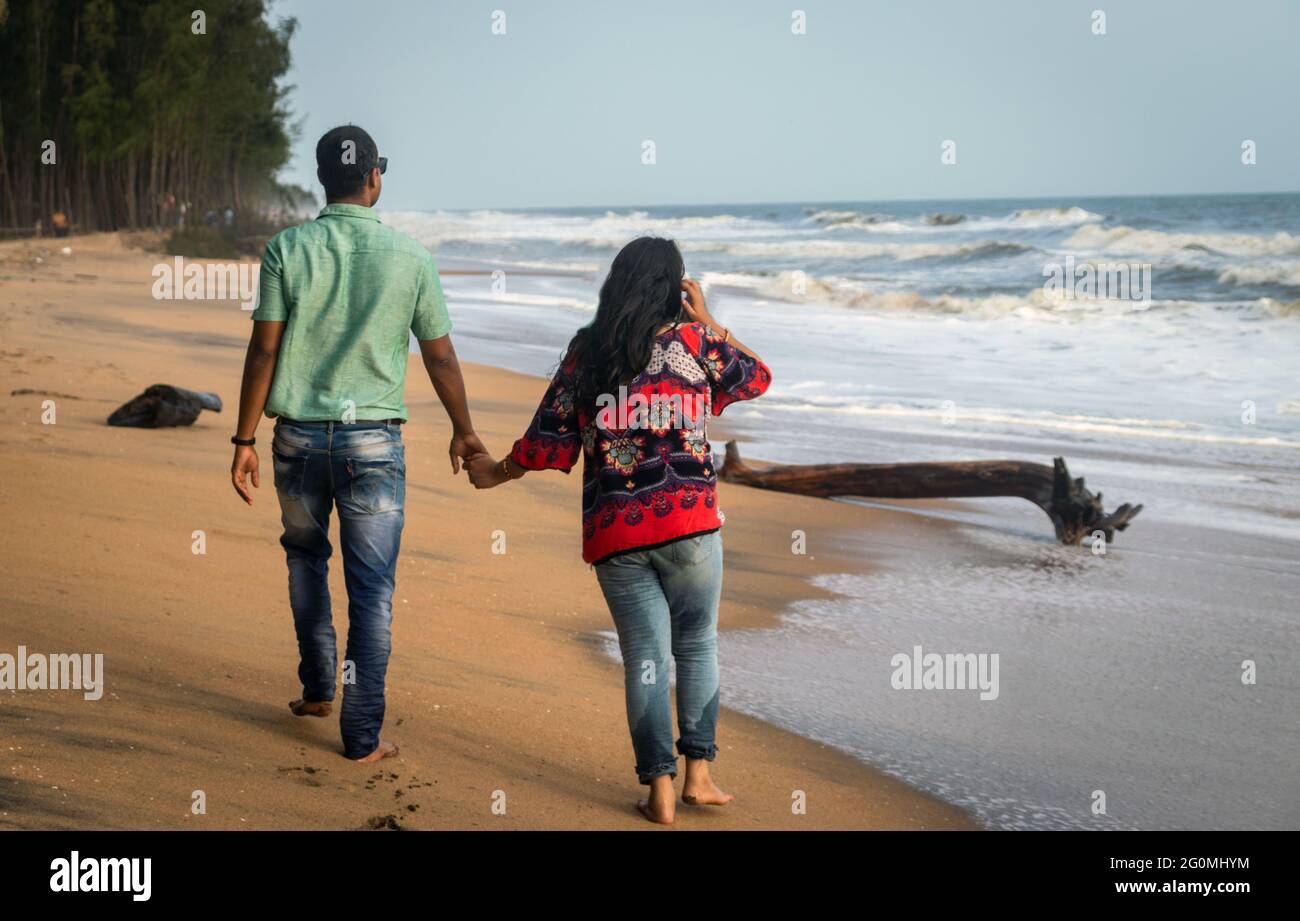 Indian couple holding others hand hi-res stock photography and images ...