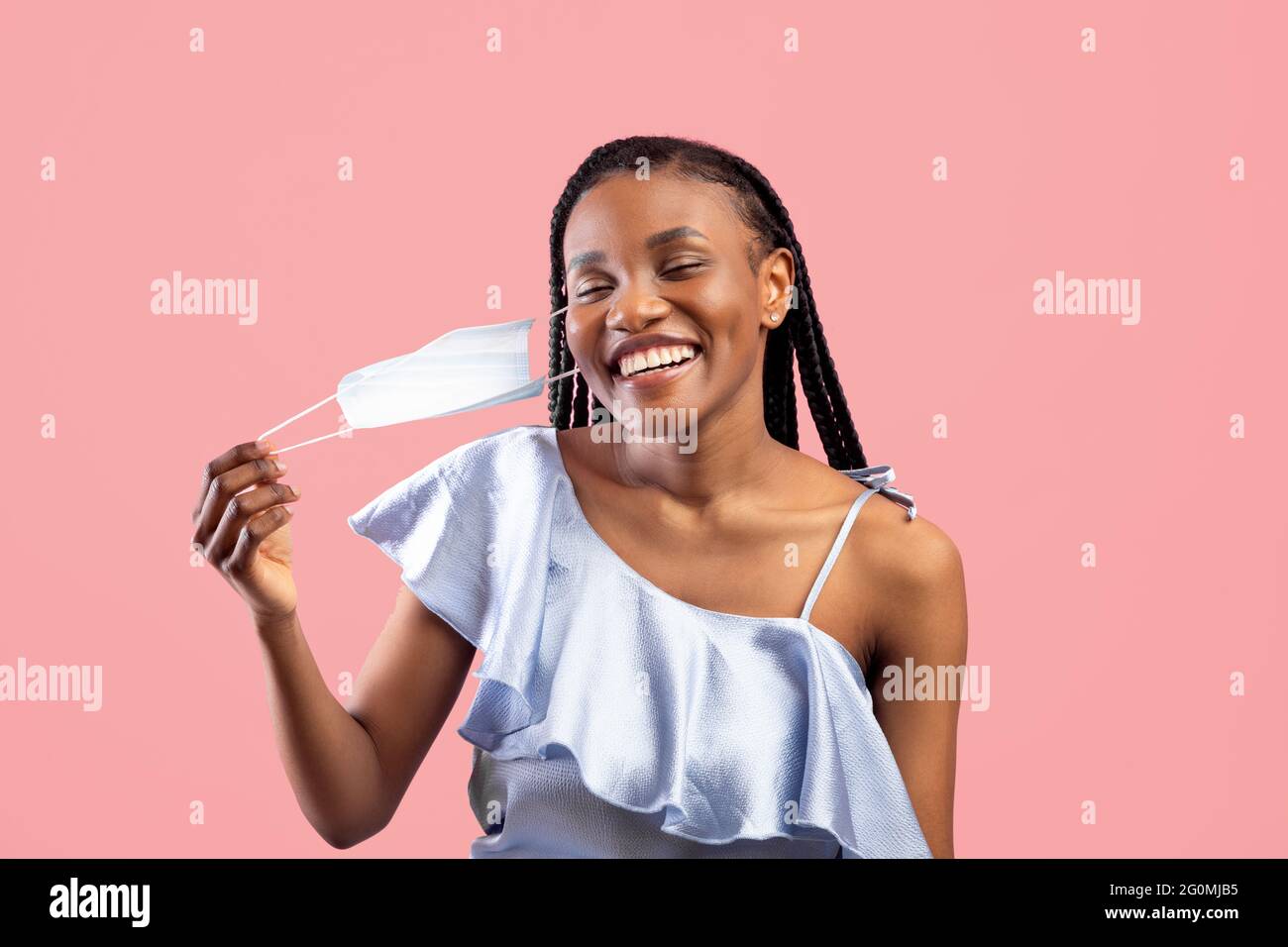 Coronavirus is over. Happy black woman with afro bunches taking off her ...