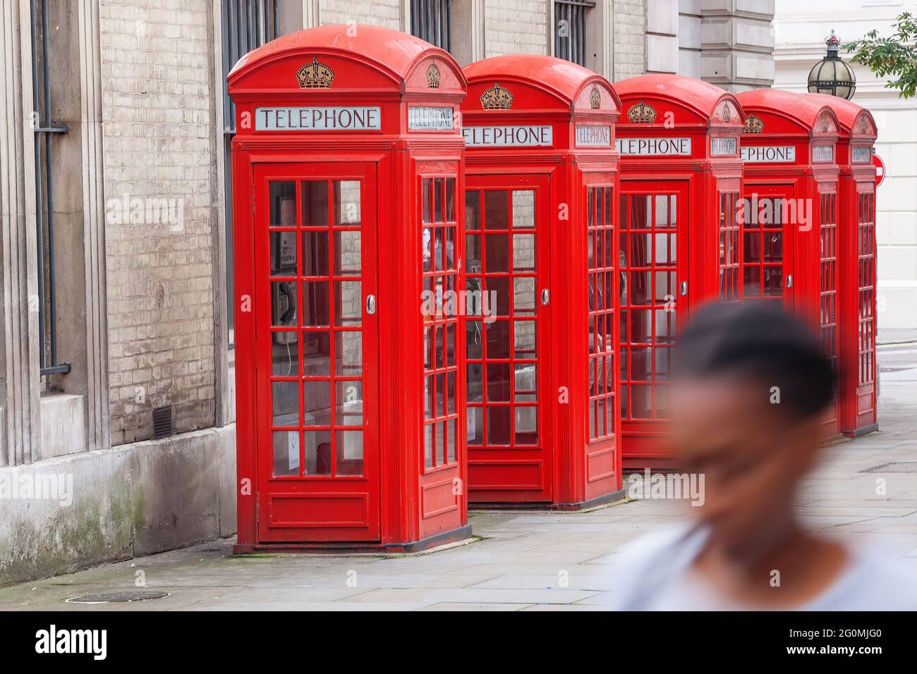 Typical red phone booths in the city of london hi-res stock photography ...
