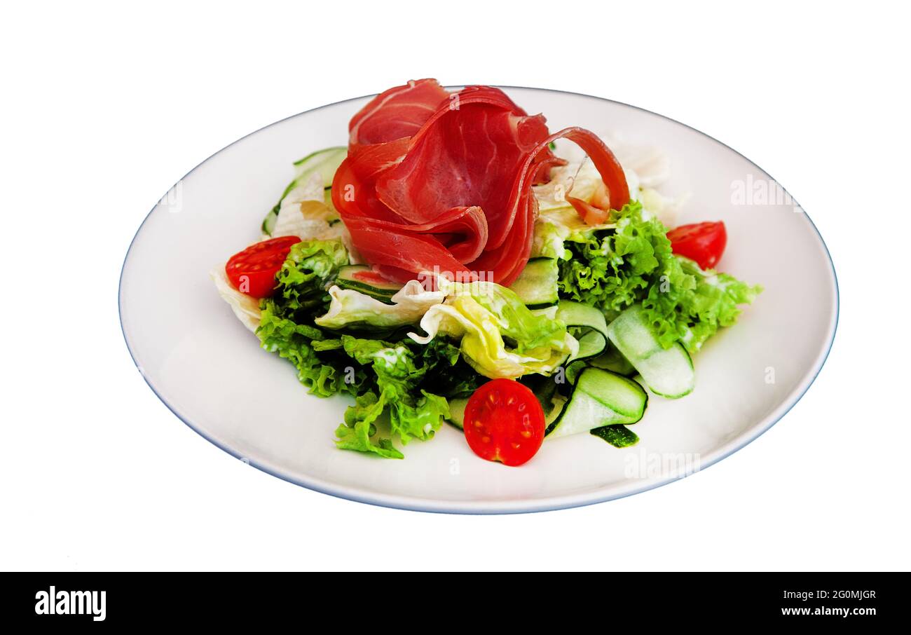 Salad with ham and vegetables lettuce, cabbage, tomato. Jamon jerky on ...