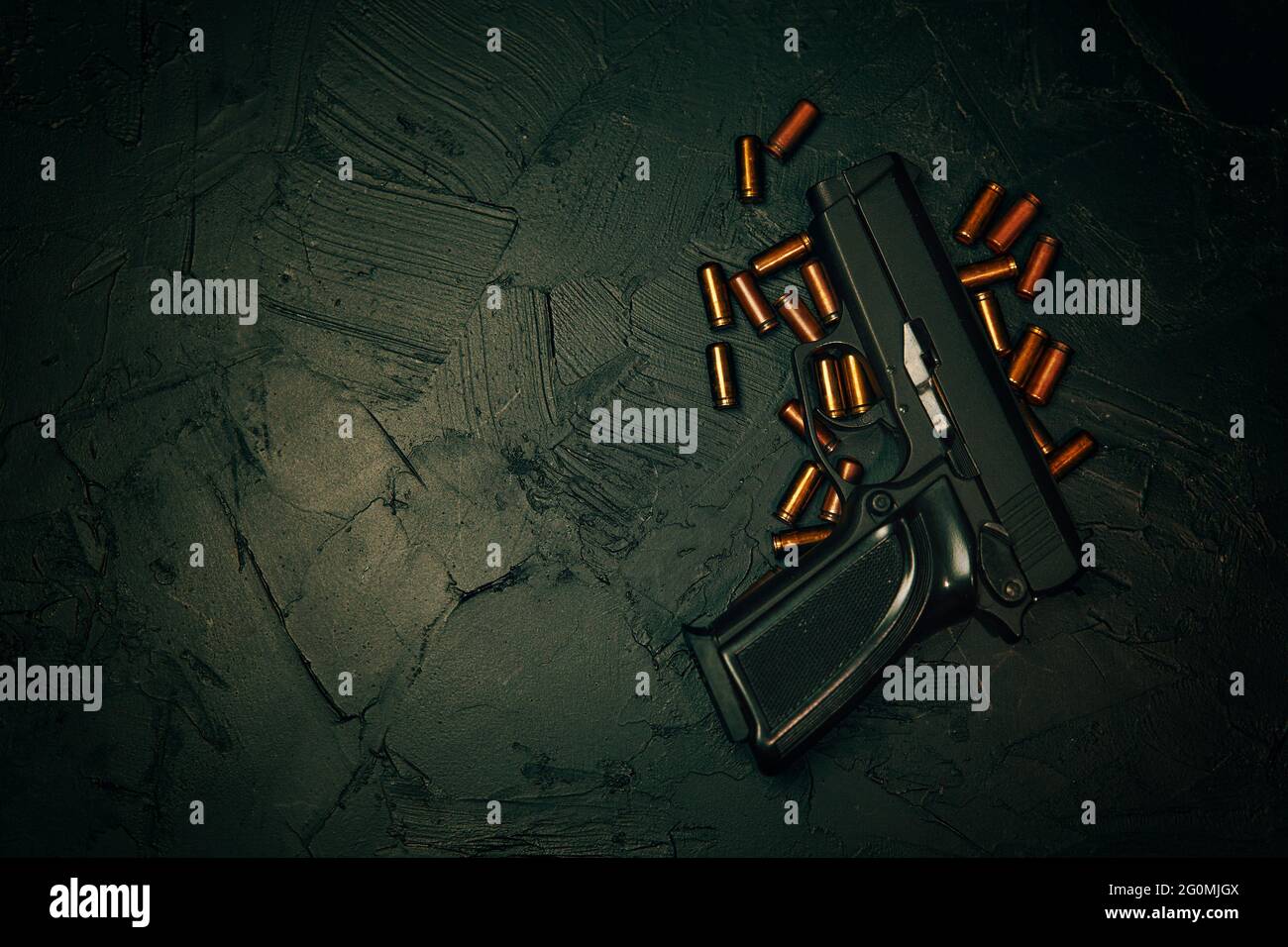 Top view of pistol and bullets. Flat lay with copy space of gun and ...