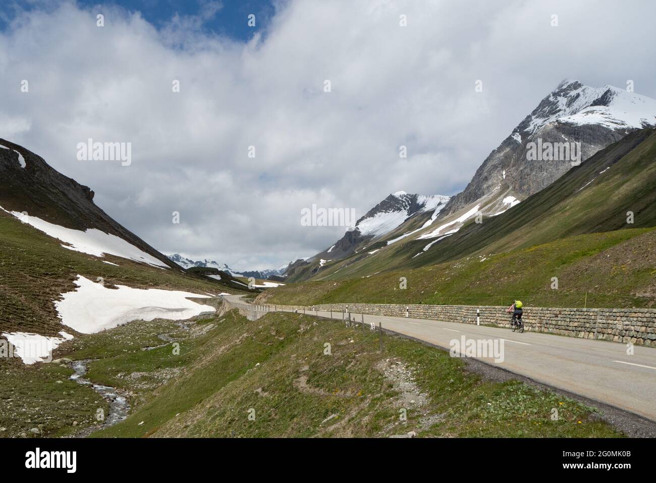 Cycling on the top of Albula pass, Switzerland, through mountainous ...