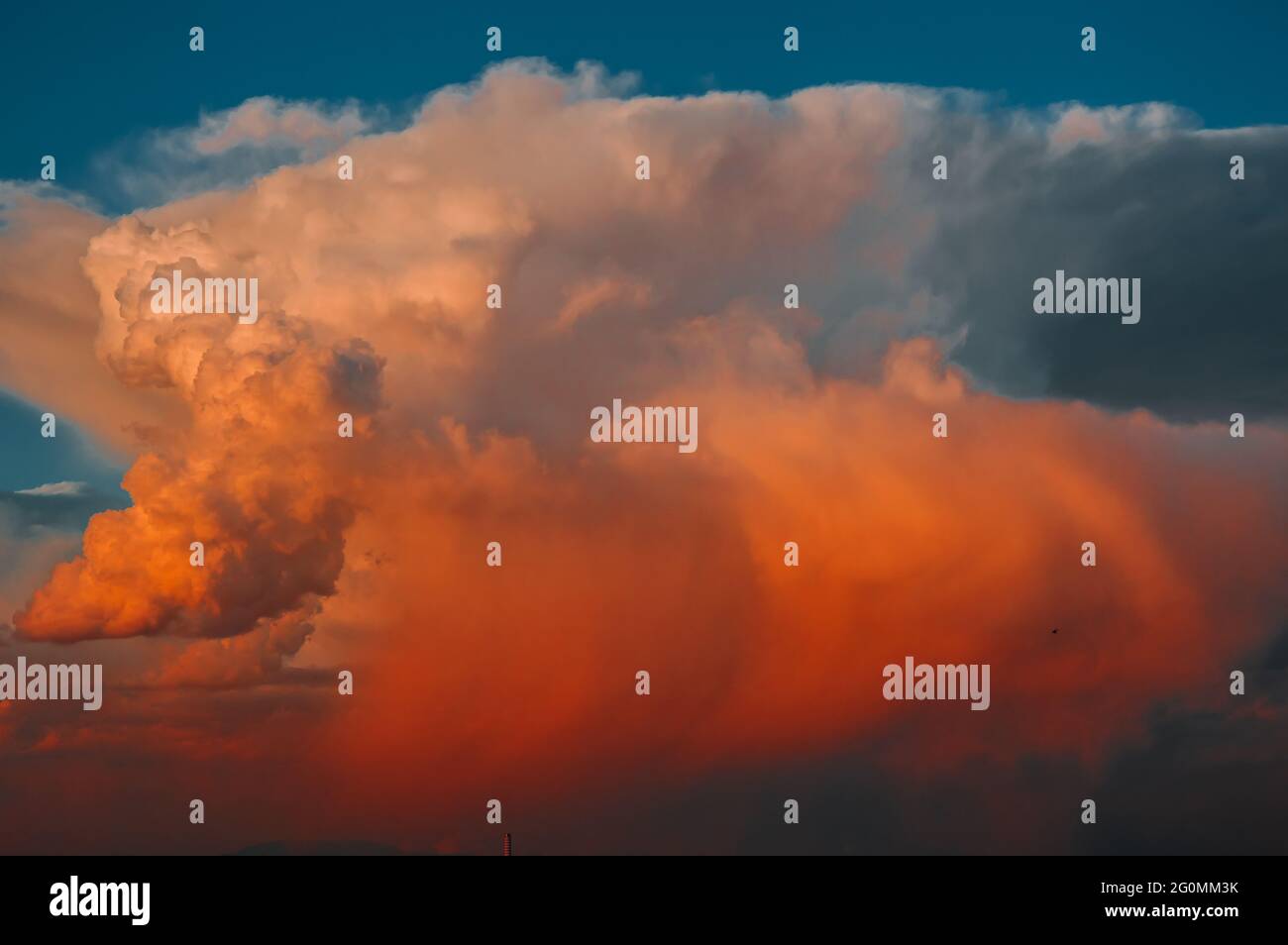 Colored air clouds in the sunset sky Stock Photo - Alamy