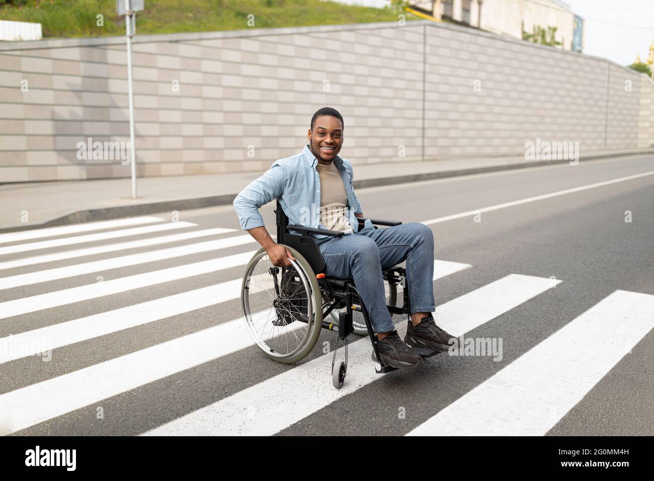 Handicapped man crossing hi-res stock photography and images - Alamy