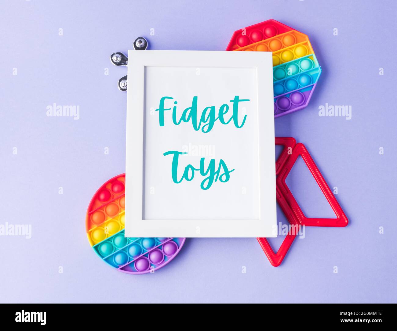 Set of colorful fidget toys for anti stress on purple with text in ...